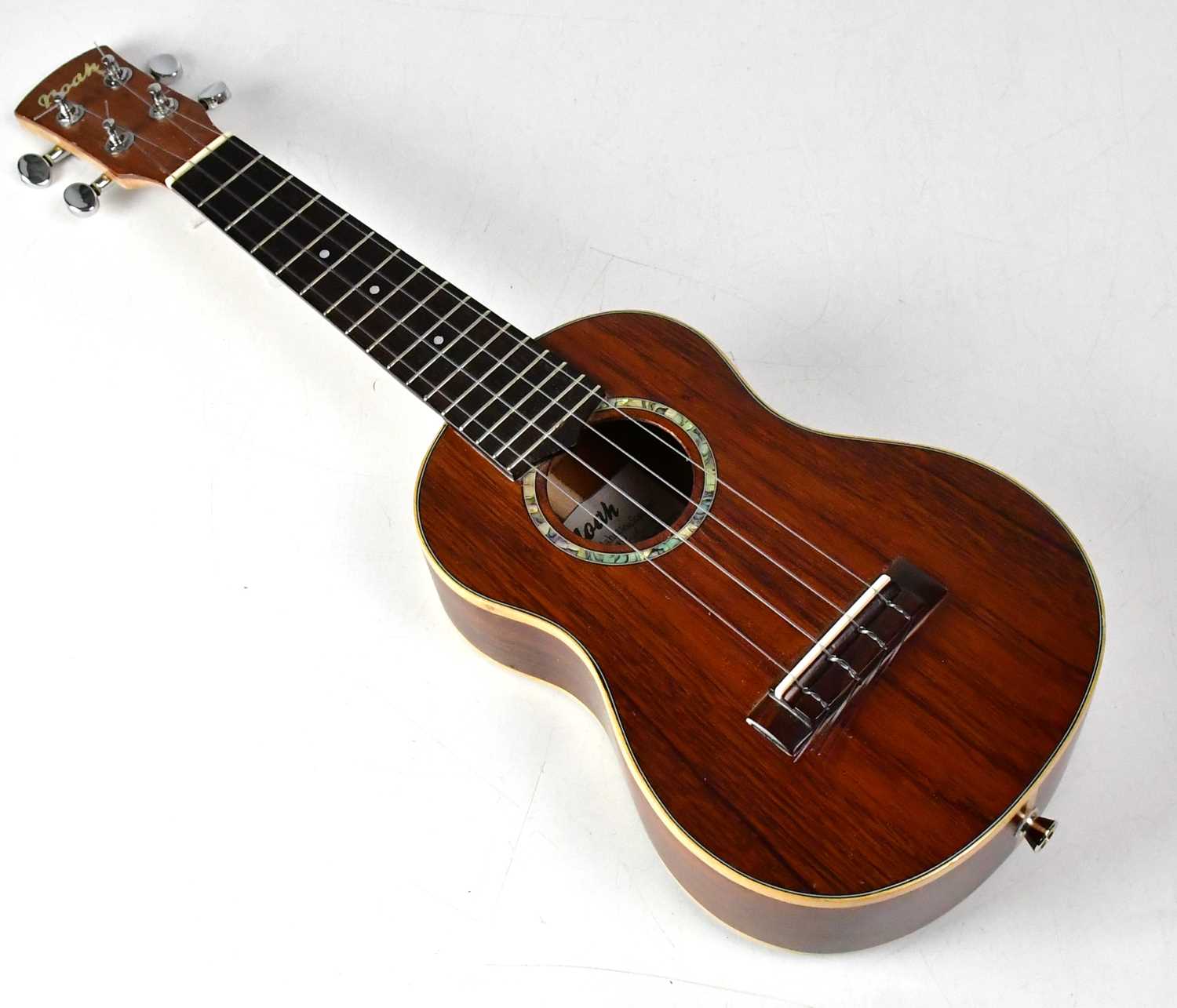 Lot 760 - A Noah mahogany soprano ukulele, with mother-