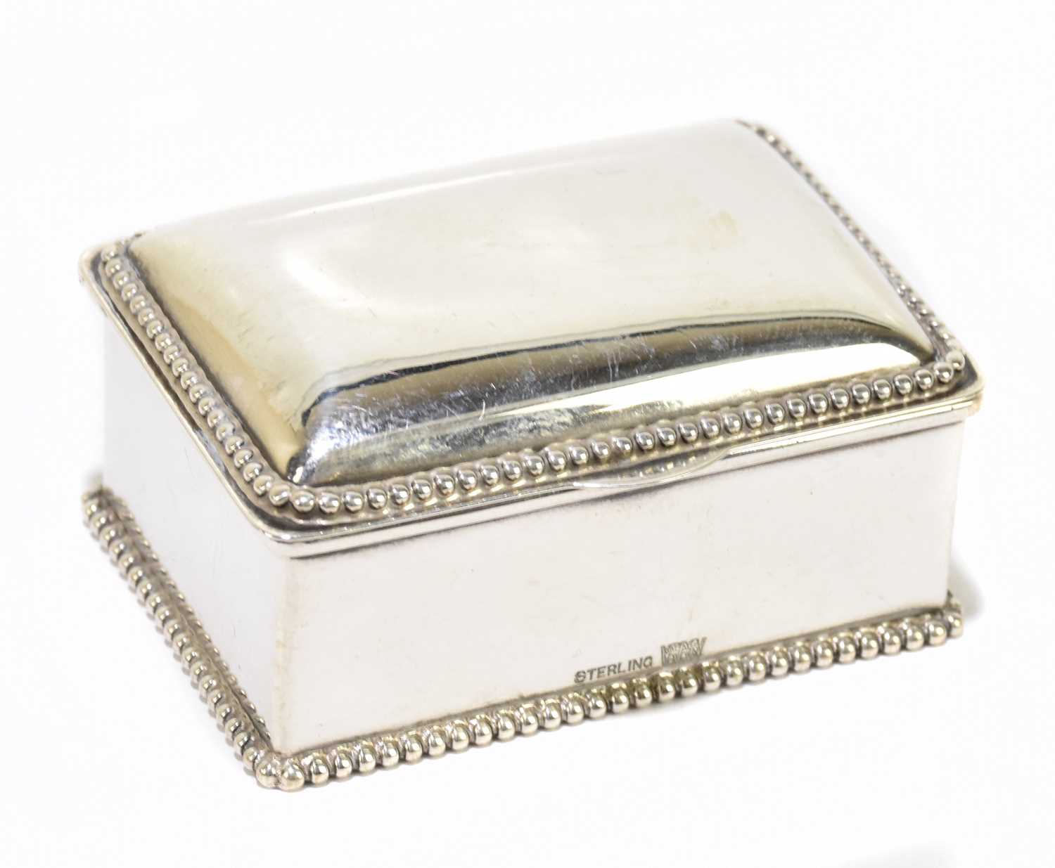 Lot 1163 - An American sterling silver double stamp