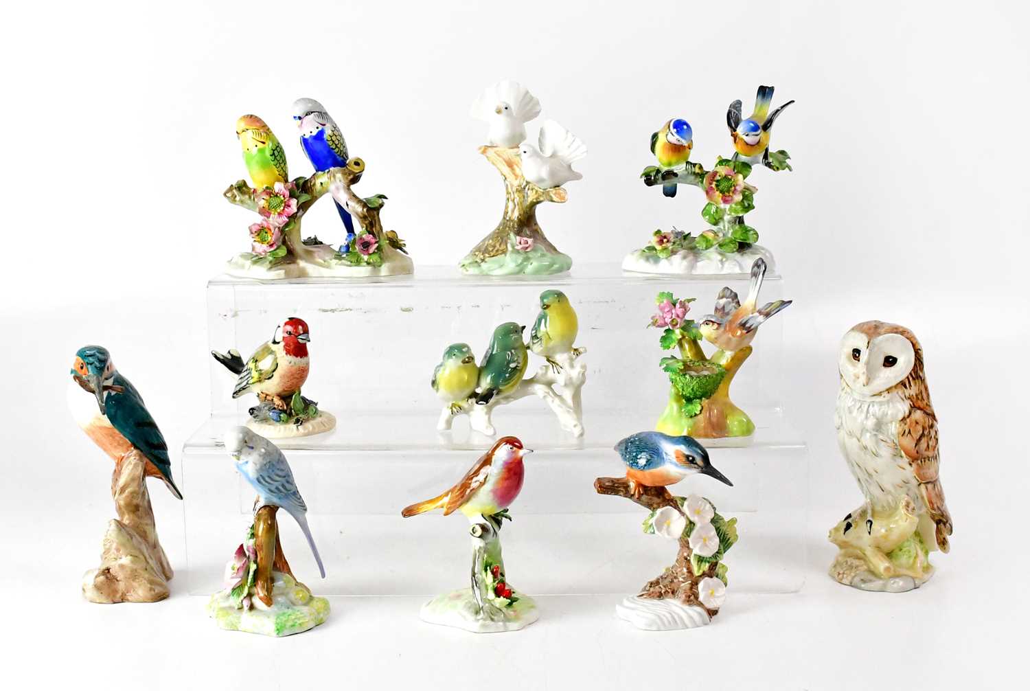 Lot 217 - Eleven various porcelain models of birds,