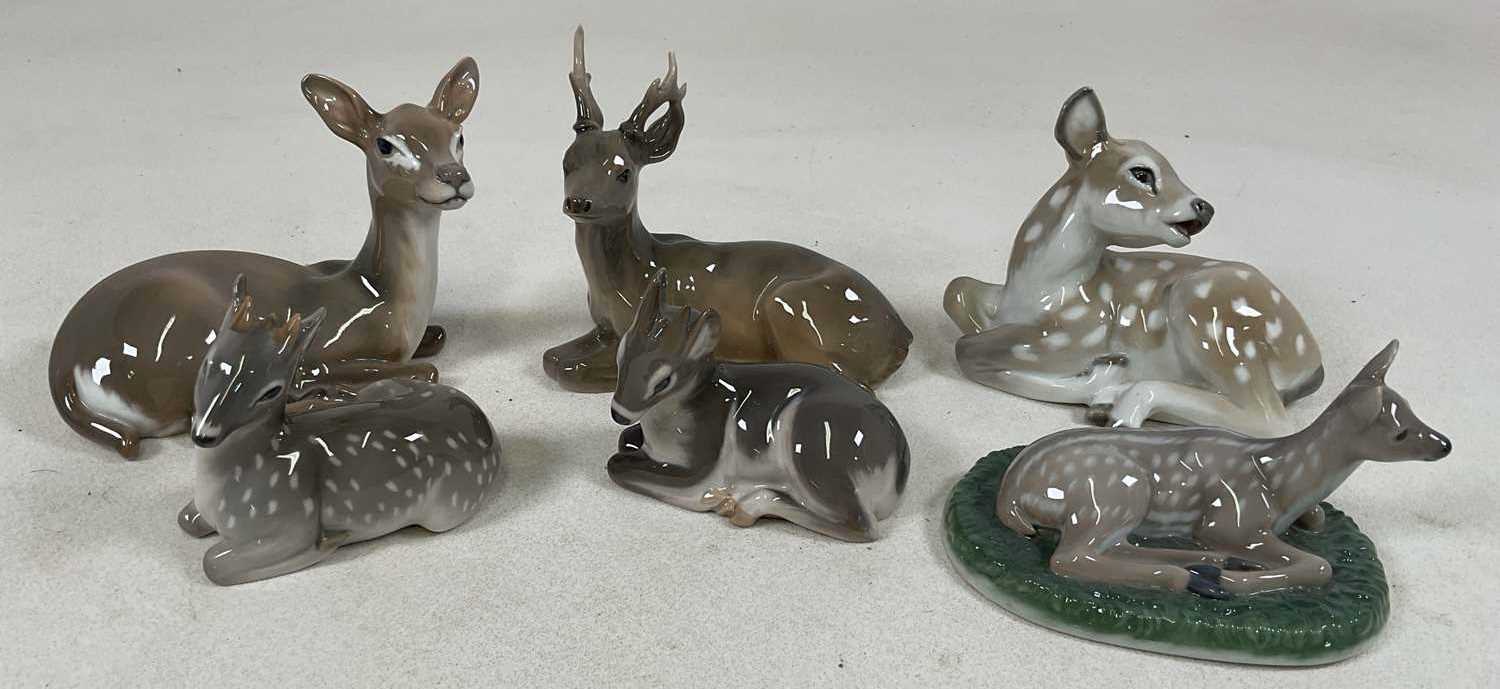 Lot 141 - ROYAL COPENHAGEN; group of six seated deer,