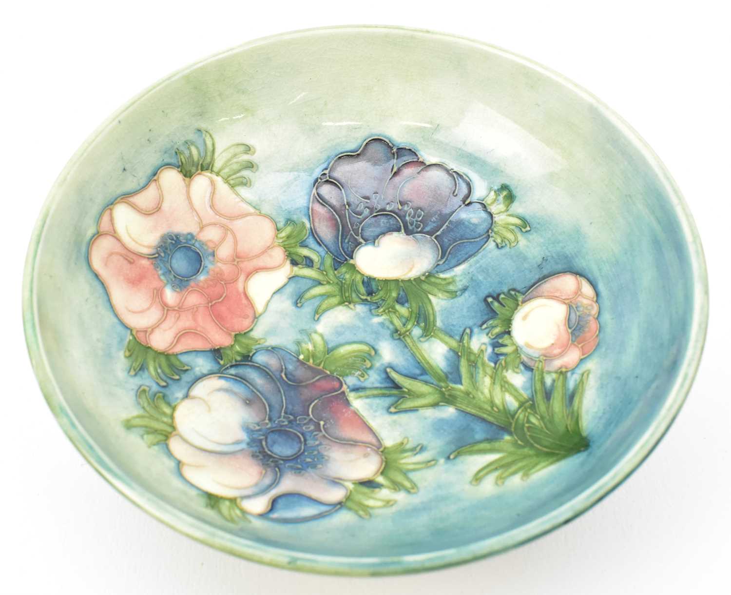 Lot 561 - WALTER MOORCROFT; a conical dish with tube