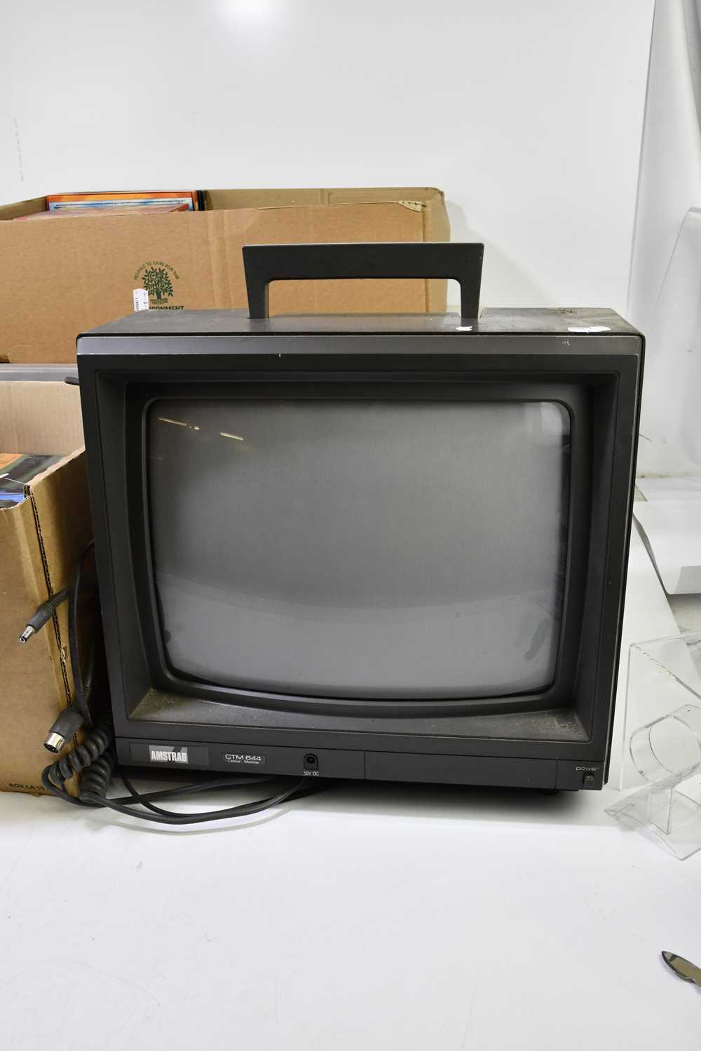 Lot 26 - AMSTRAD; game system, together with approx