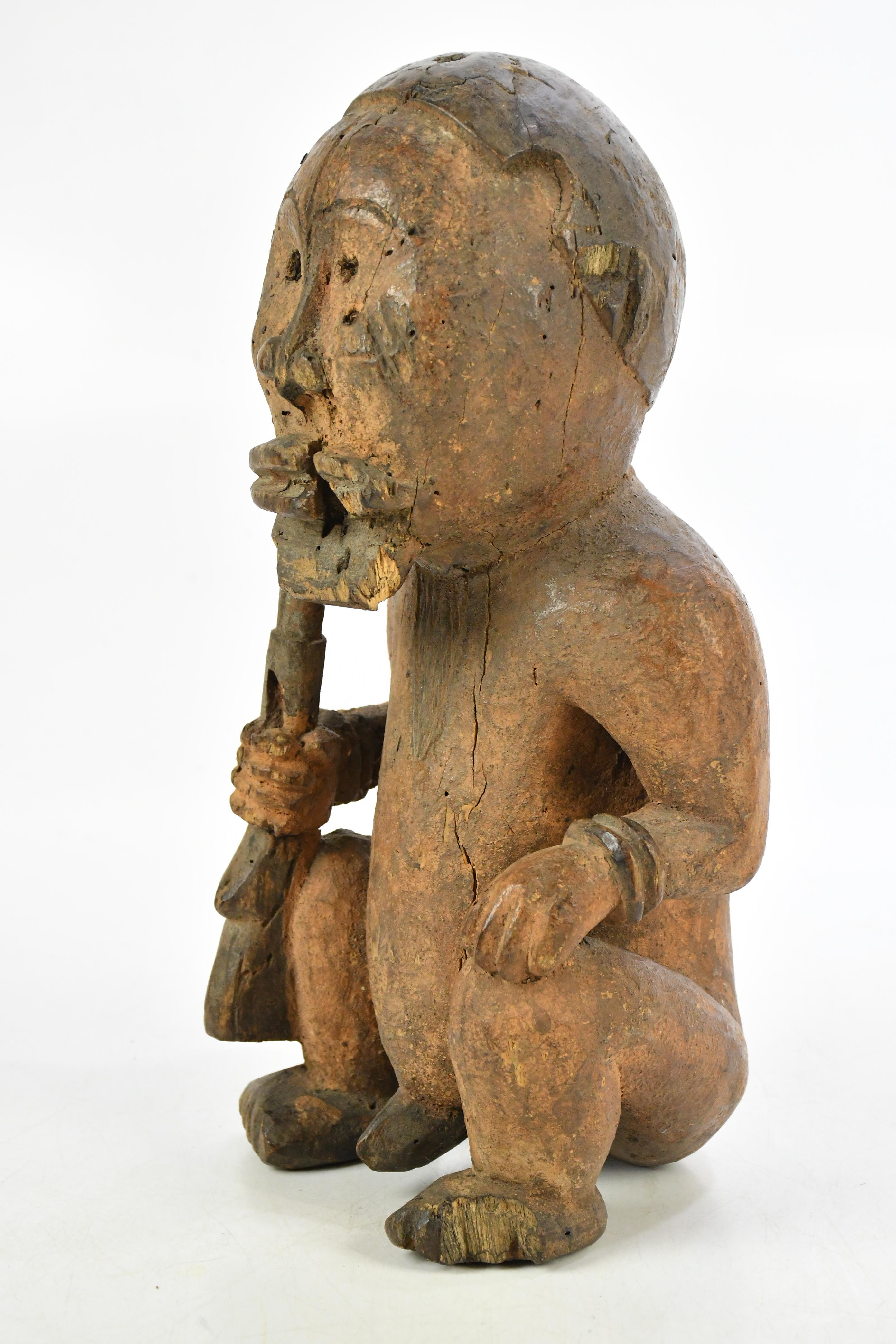 Lot 586 - A carved wooden African ancestor figure,