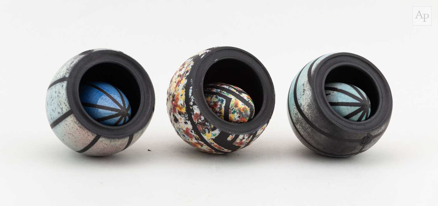 Lot 214 - ERIC MOSS (born 1959); a trio of raku seed