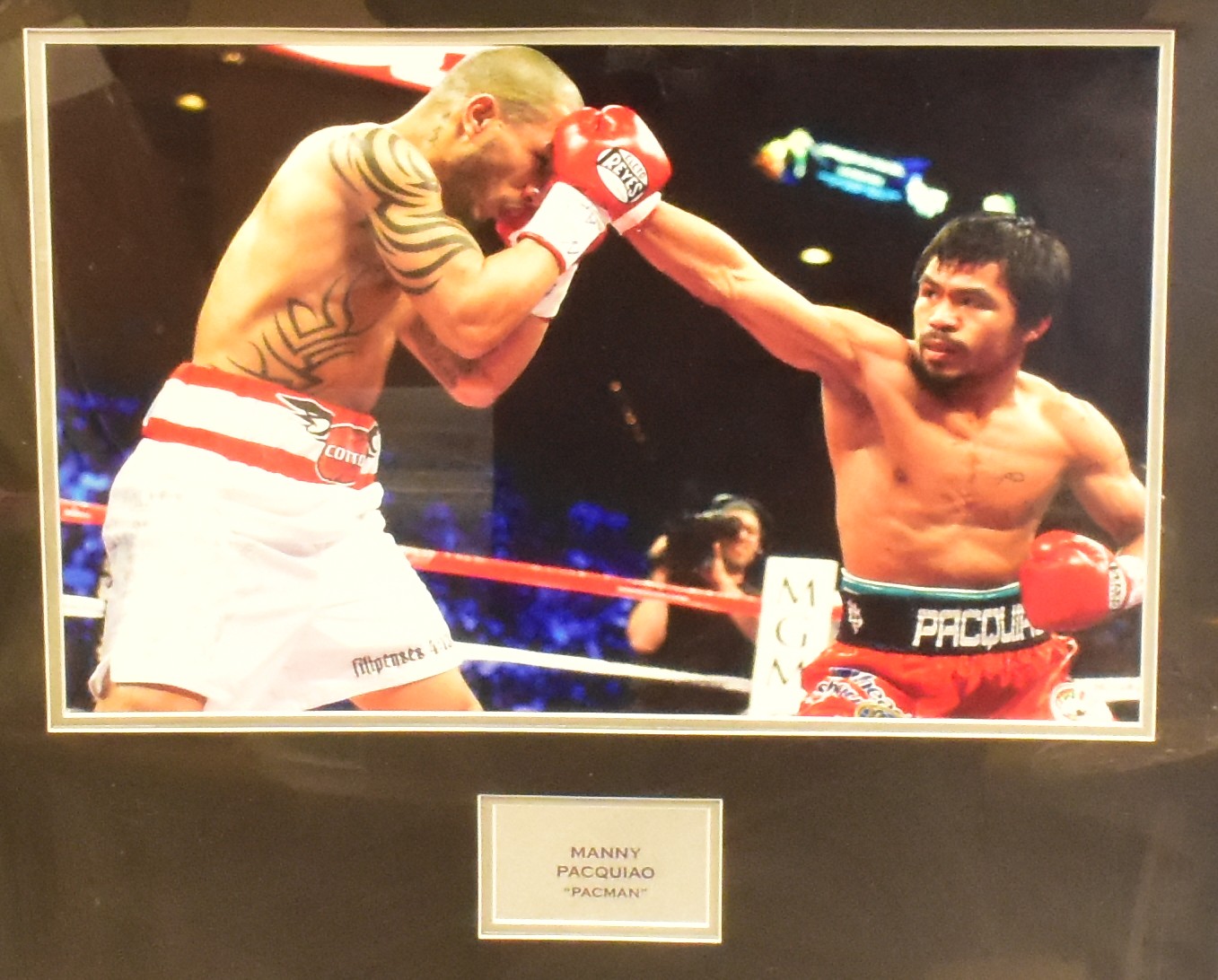 Lot 23 - MANNY PACQUIAO (PACMAN); a framed display