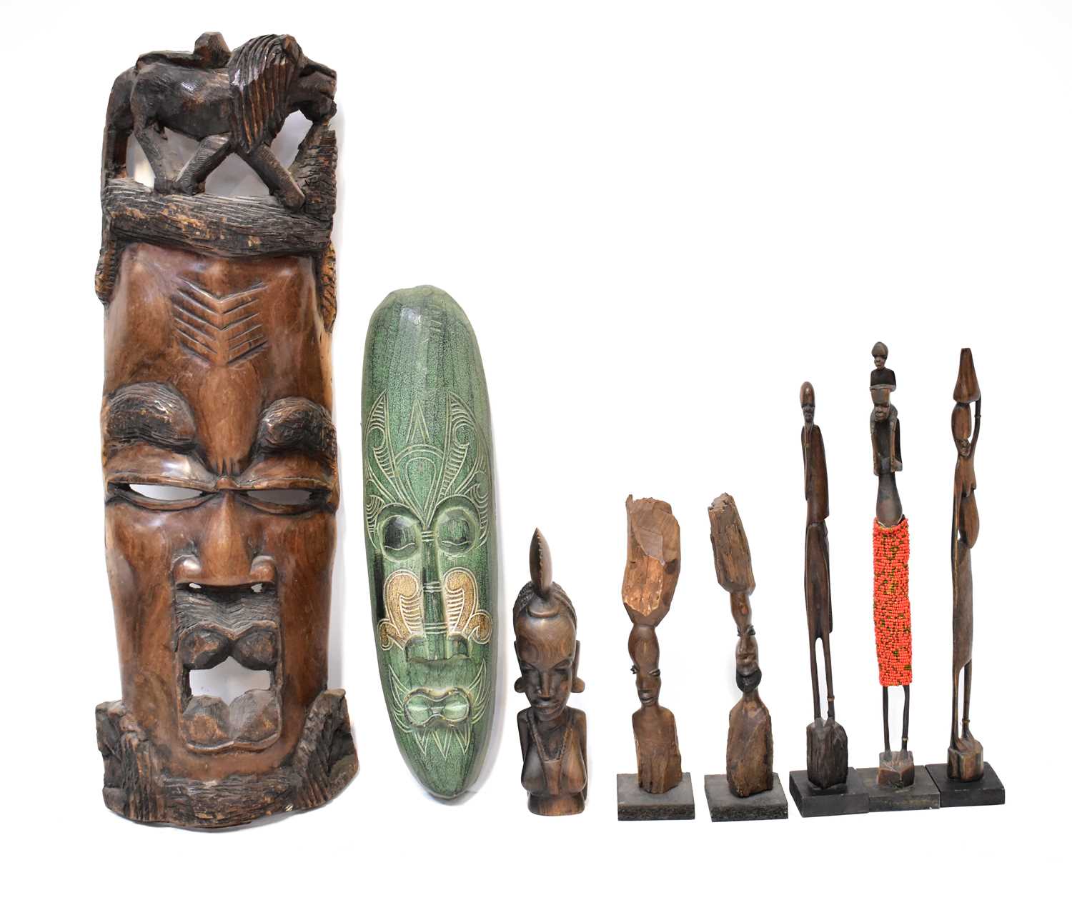 Lot 351 - A large carved wooden African mask, the head
