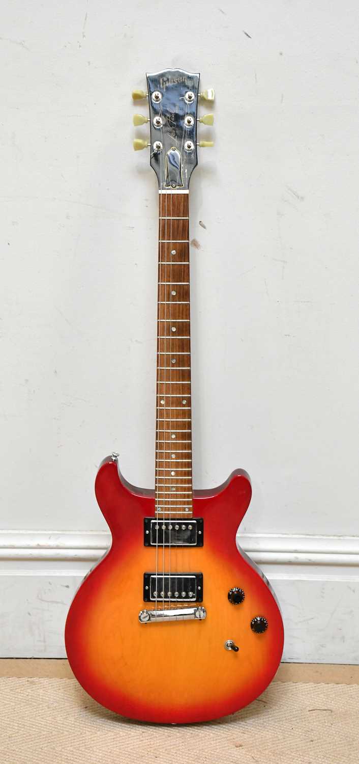 Lot 1031 - GIBSON; a double cutaway Les Paul guitar,
