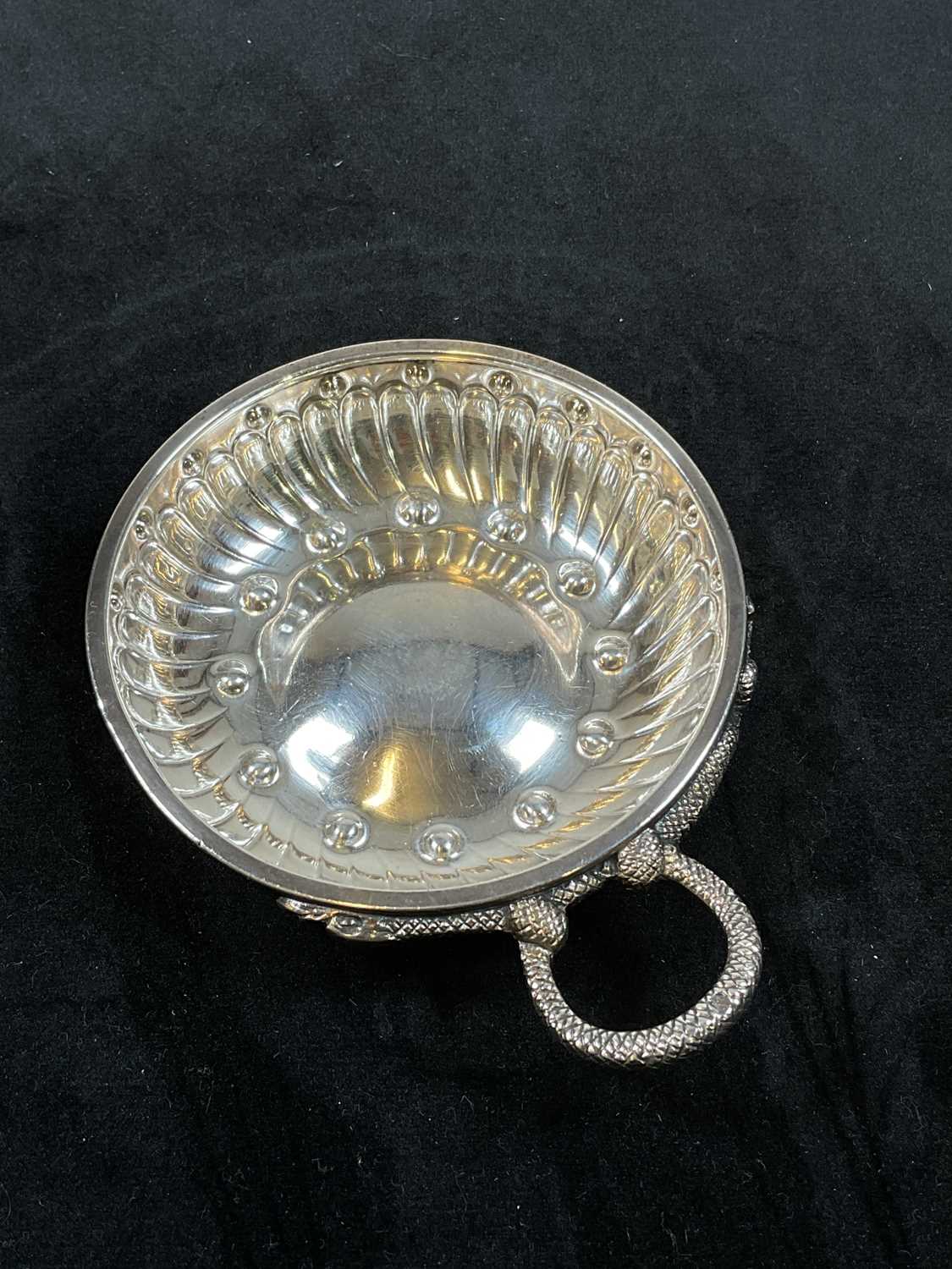 Lot 412 - A French silver tastevin with stylised