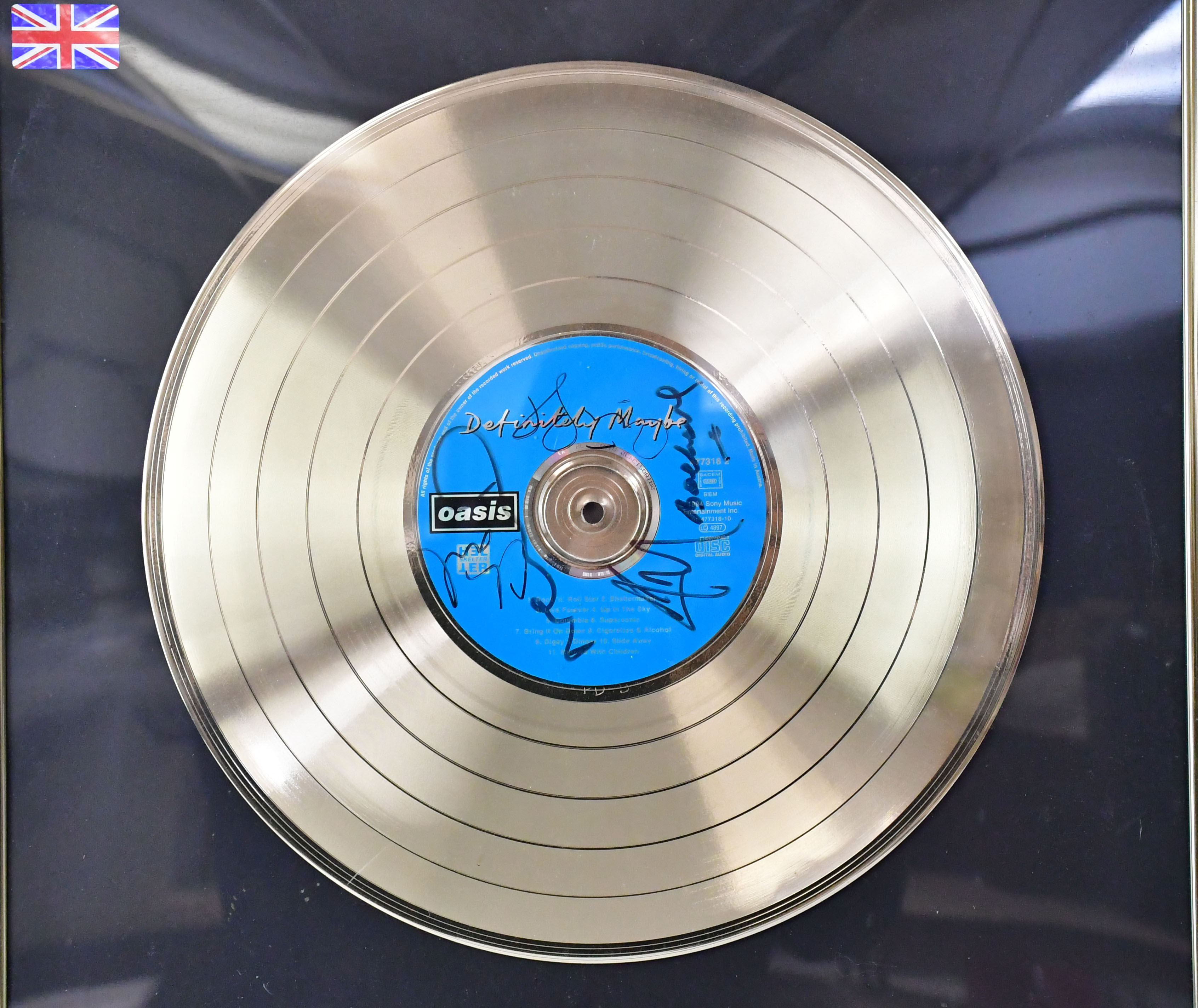 Lot 322 - OASIS; a gold disc, 'Definitely Maybe',