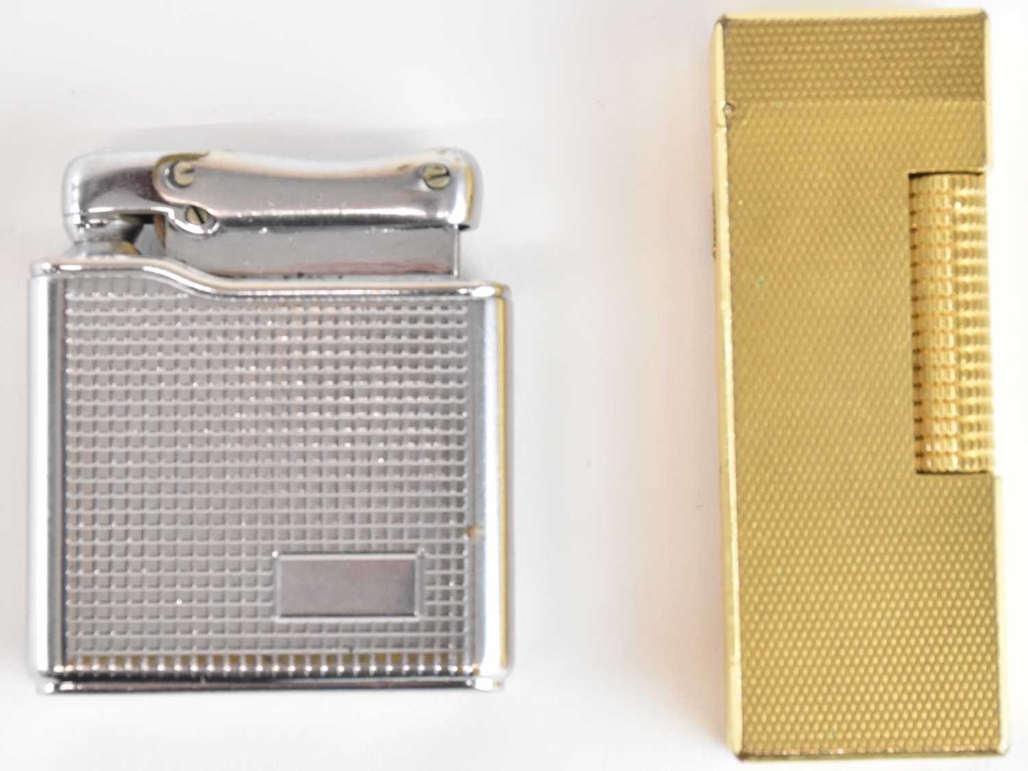 Lot 297 - DUNHILL; a gold plated Rollagas lighter with