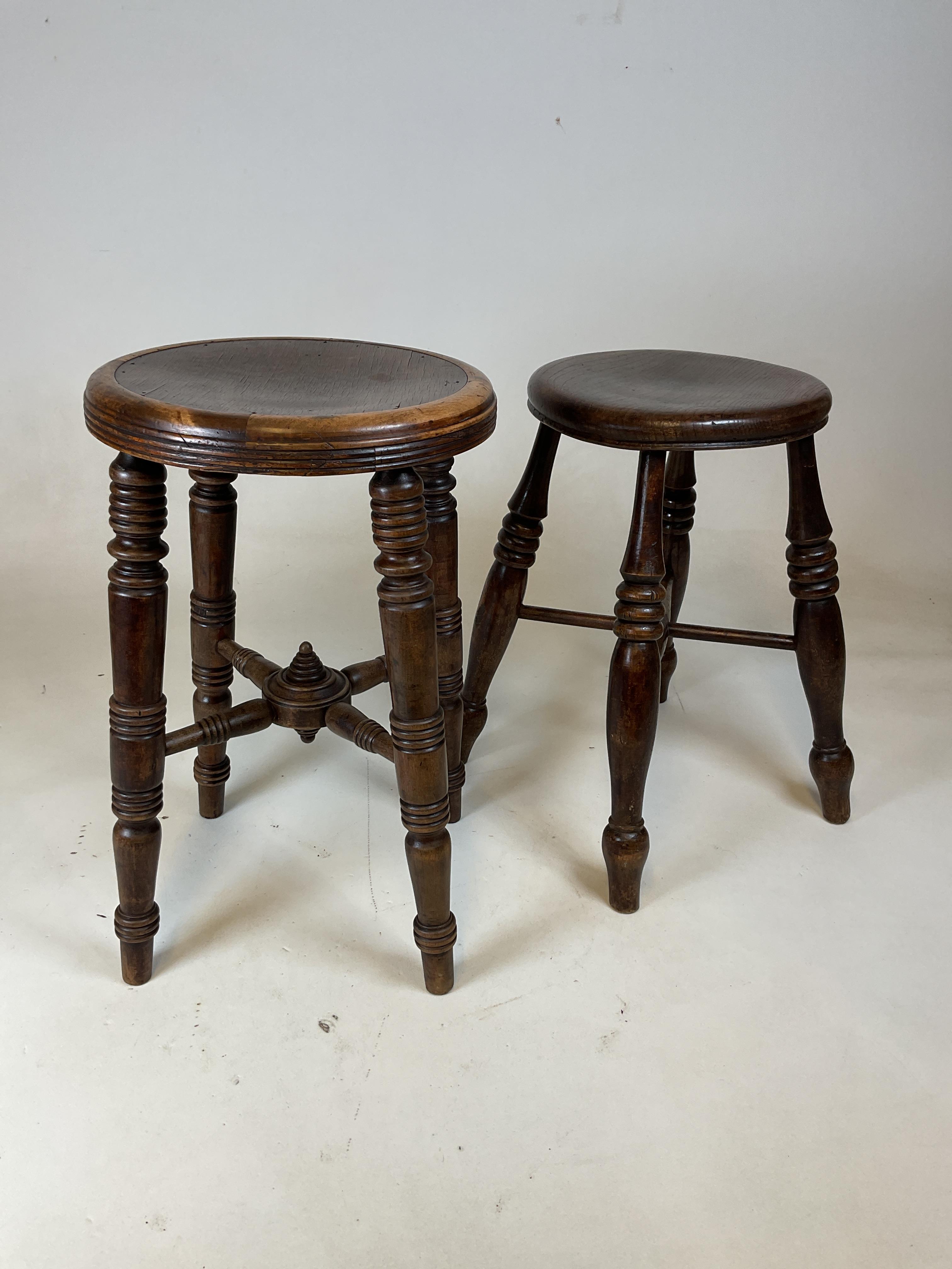 Lot 745 - An elm seated stool raised on ring turned