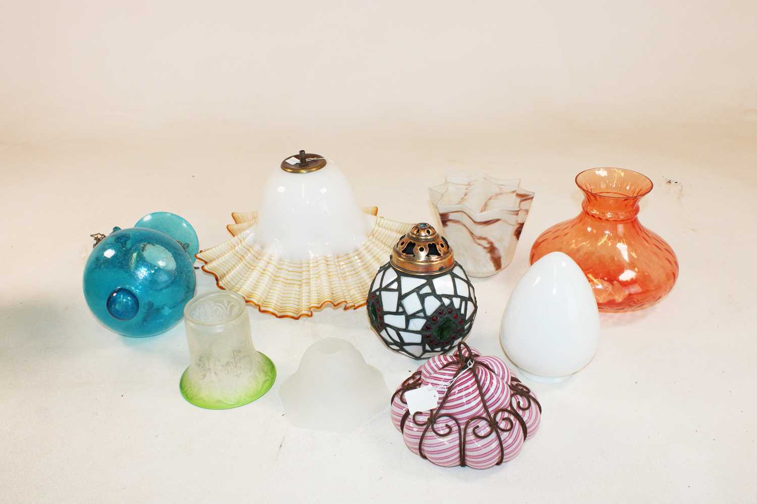 Lot 1242 - A group of glass light fittings and shades.