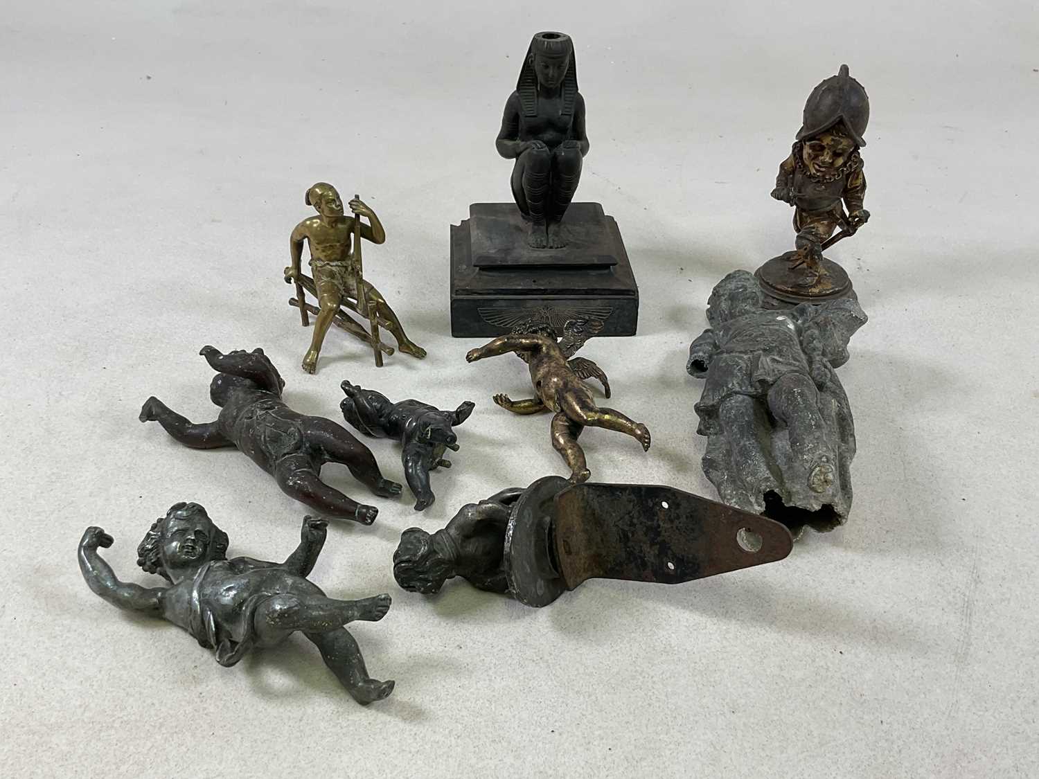 Lot 1136 - A group of metal figures including a