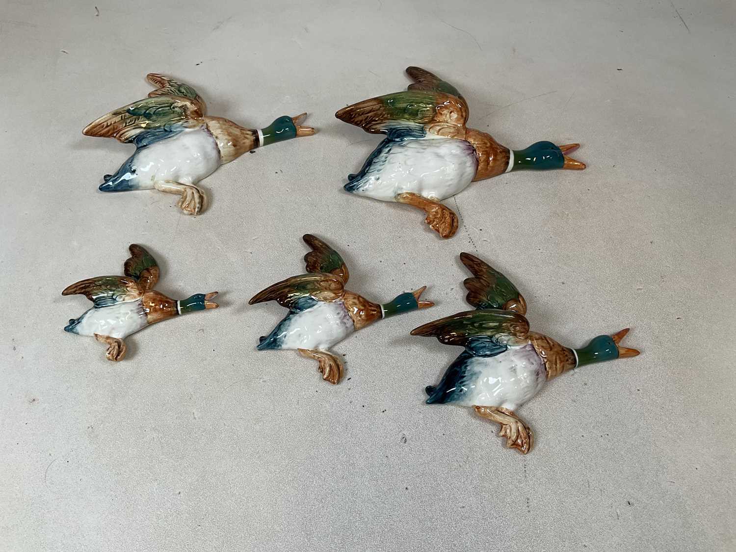 Lot 240 - BESWICK; a set of five wall mounted flying