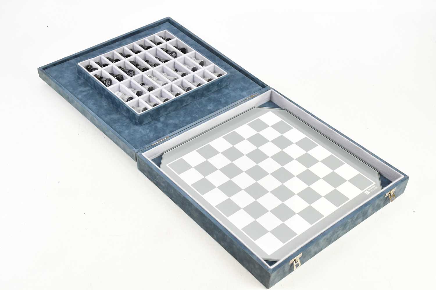 Lot 318 - SWAROVSKI; a boxed chess set and board.