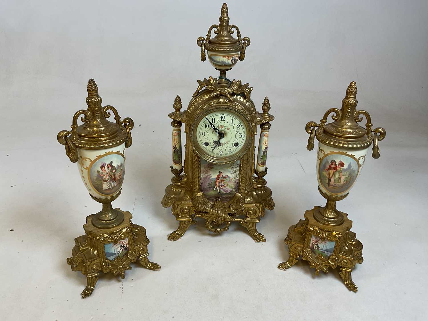 Lot 397 - A decorative reproduction brass three piece