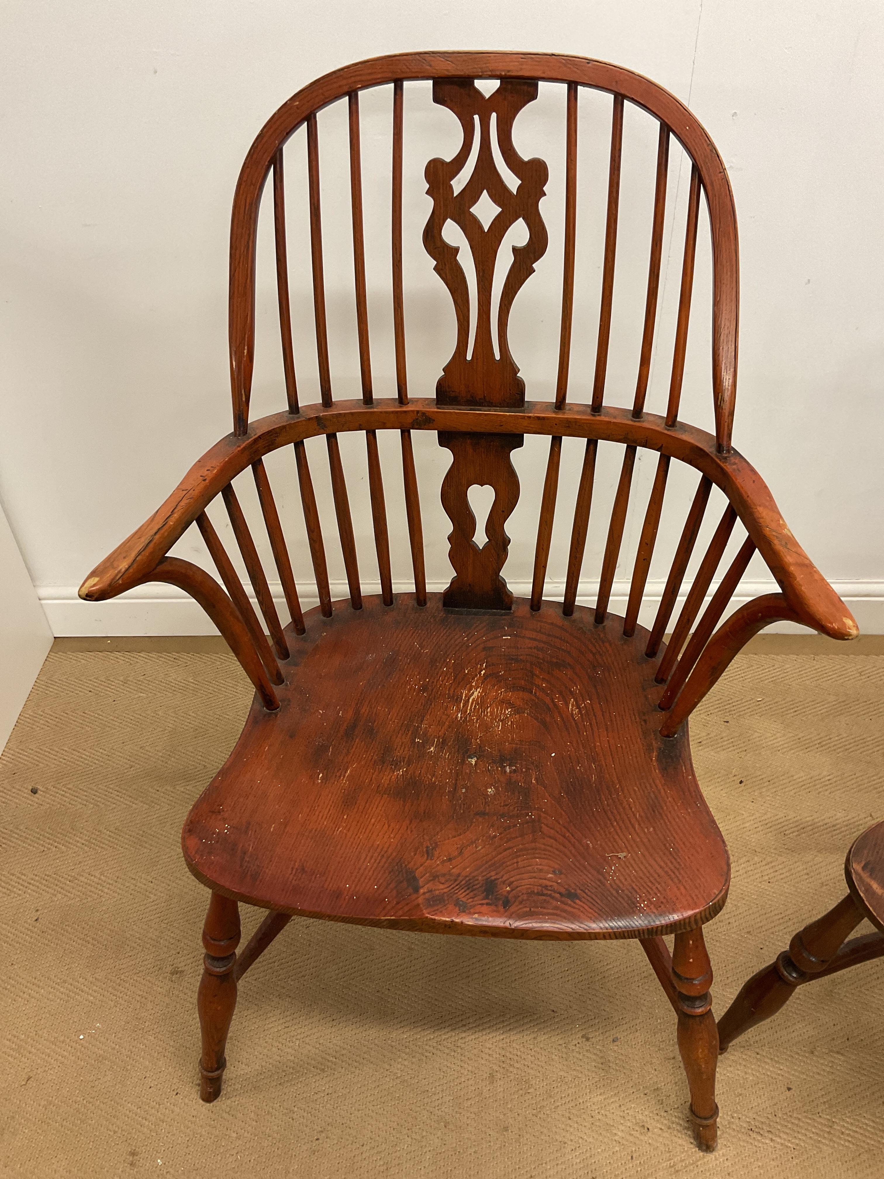 Lot 698 - A matched set of seven hoop back chairs with