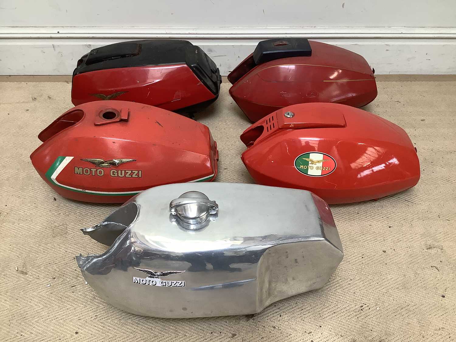 Lot 2008 - A collection of five Moto Guzzi fuel tanks