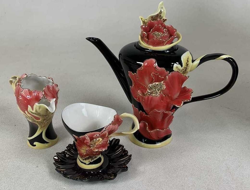 Lot 193 - FRANZ PORCELAIN; a peony tea set, comprising