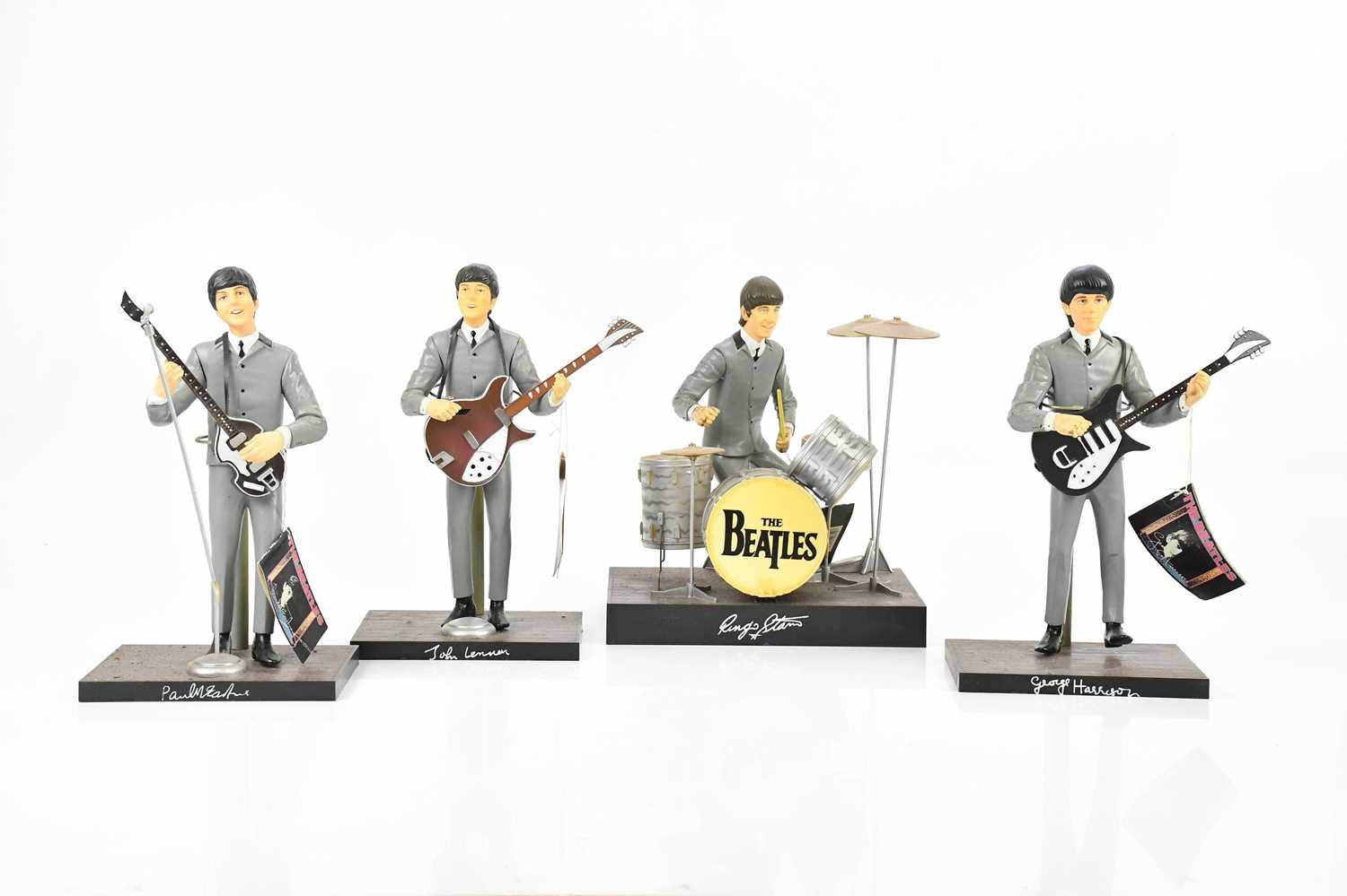 Lot 2024 - THE BEATLES; a set of four Beatles figures