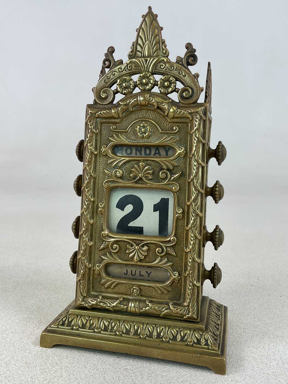 Lot 65 - A circa 1900 brass perpetual calendar, with