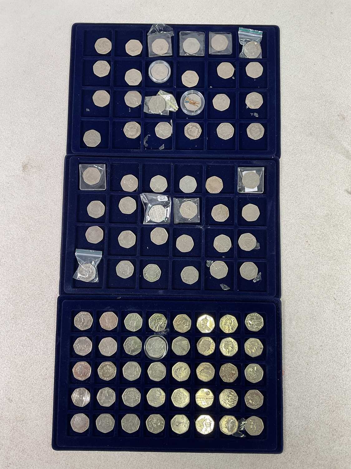 Lot 586 - ROYAL MINT; a collection of eighty-four 50ps.