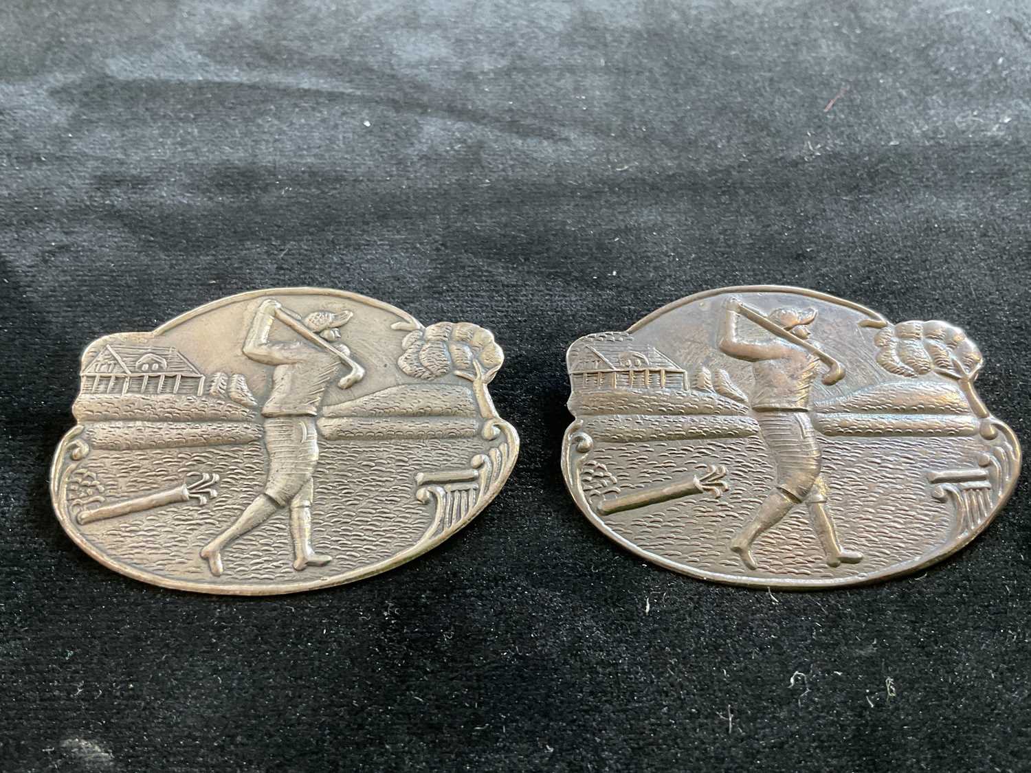 Lot 580 - Two identical sterling silver golf brooches