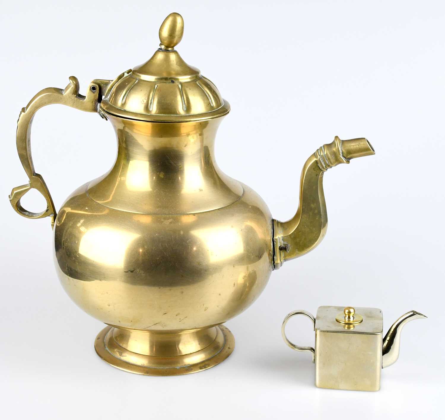 Lot 2329 - An Eastern brass ewer and saffron pot,