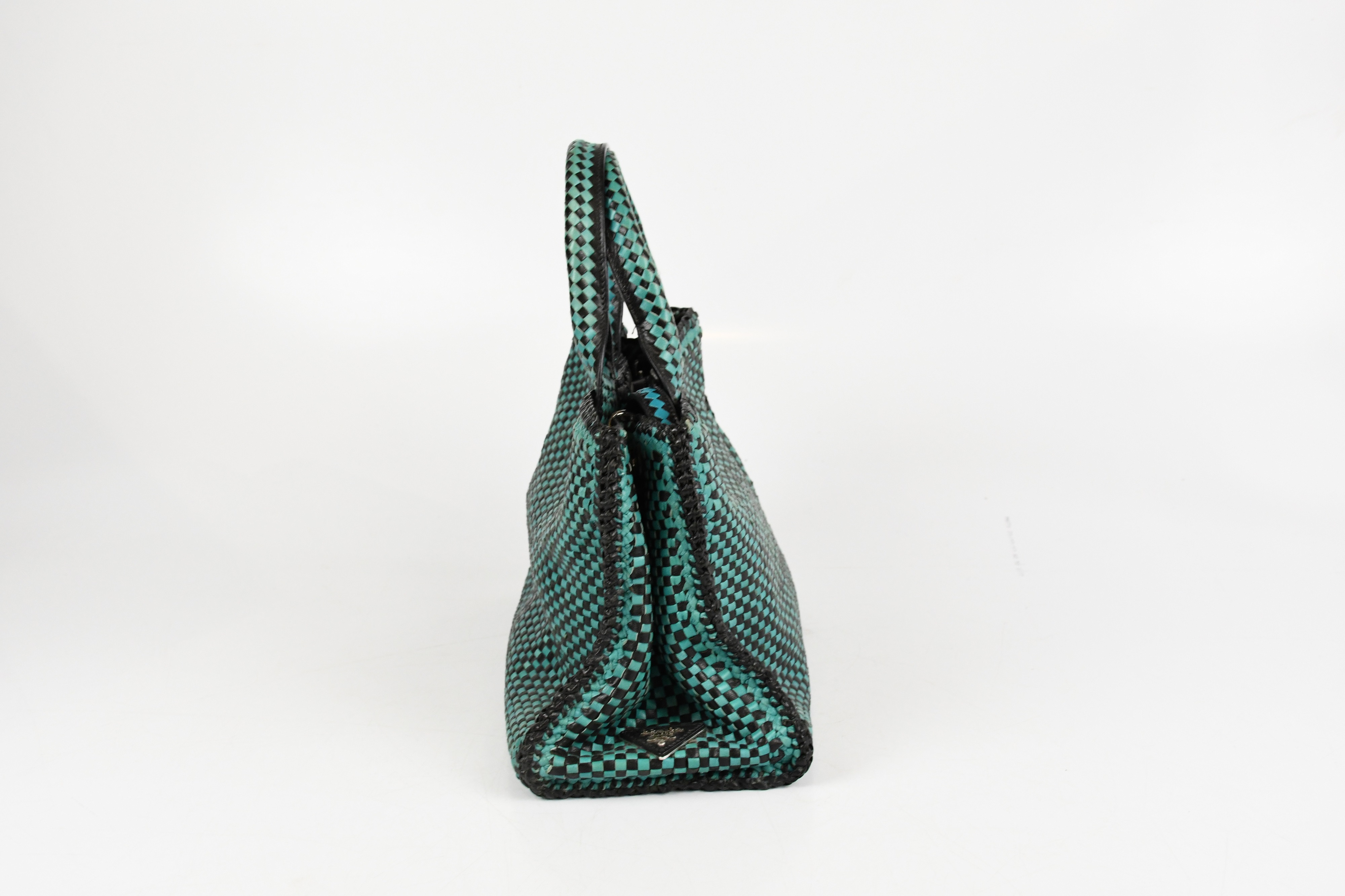 Lot 670 - PRADA; a turquoise blue and black woven