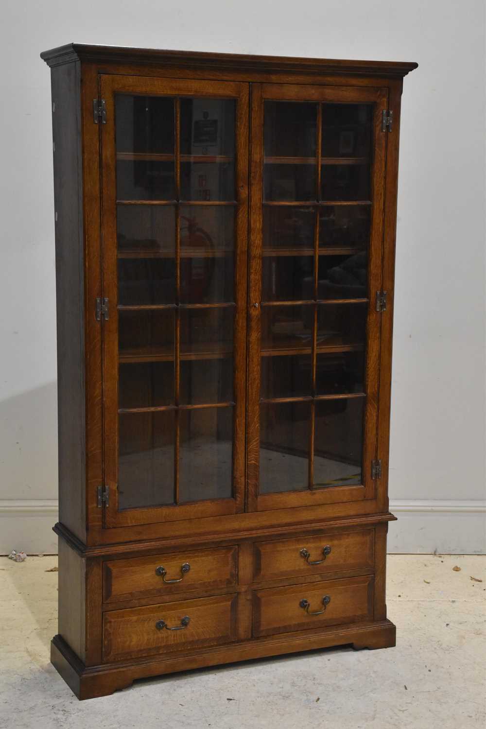 Lot 142 - A reproduction mahogany bookcase with two