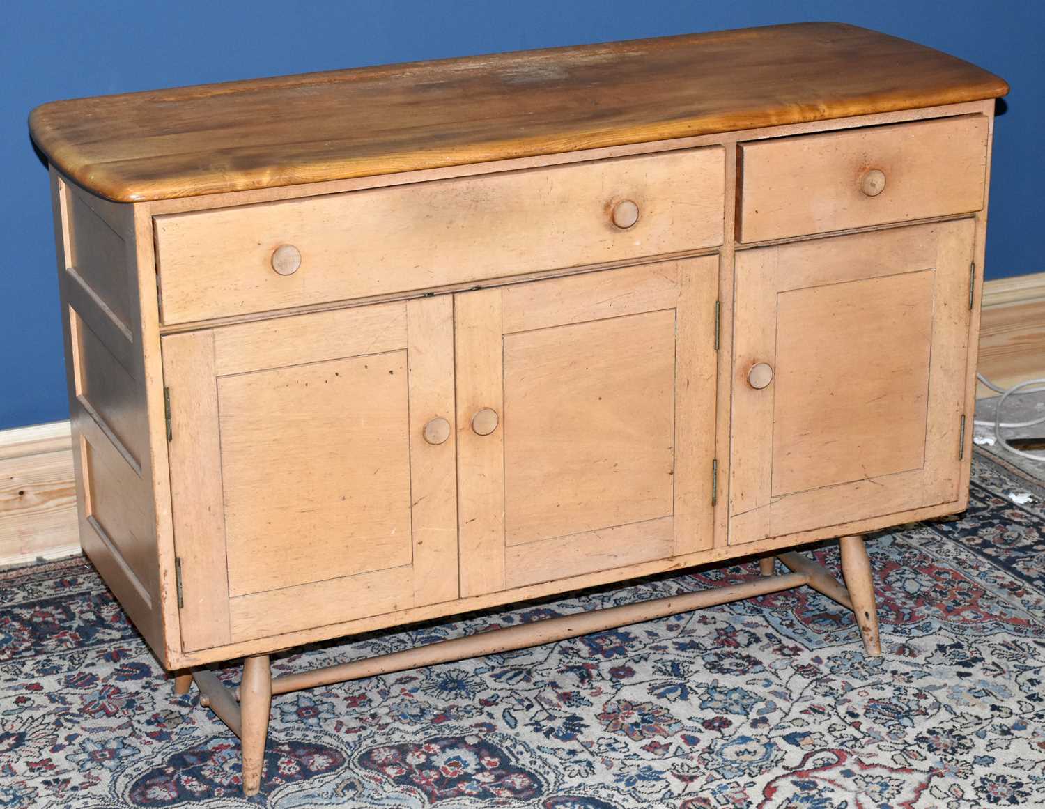Lot 1406 - ERCOL; a mid century light elm sideboard