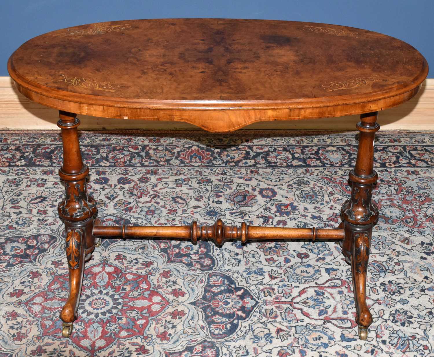 Lot 2829 - A Victorian inlaid walnut oval loo table,