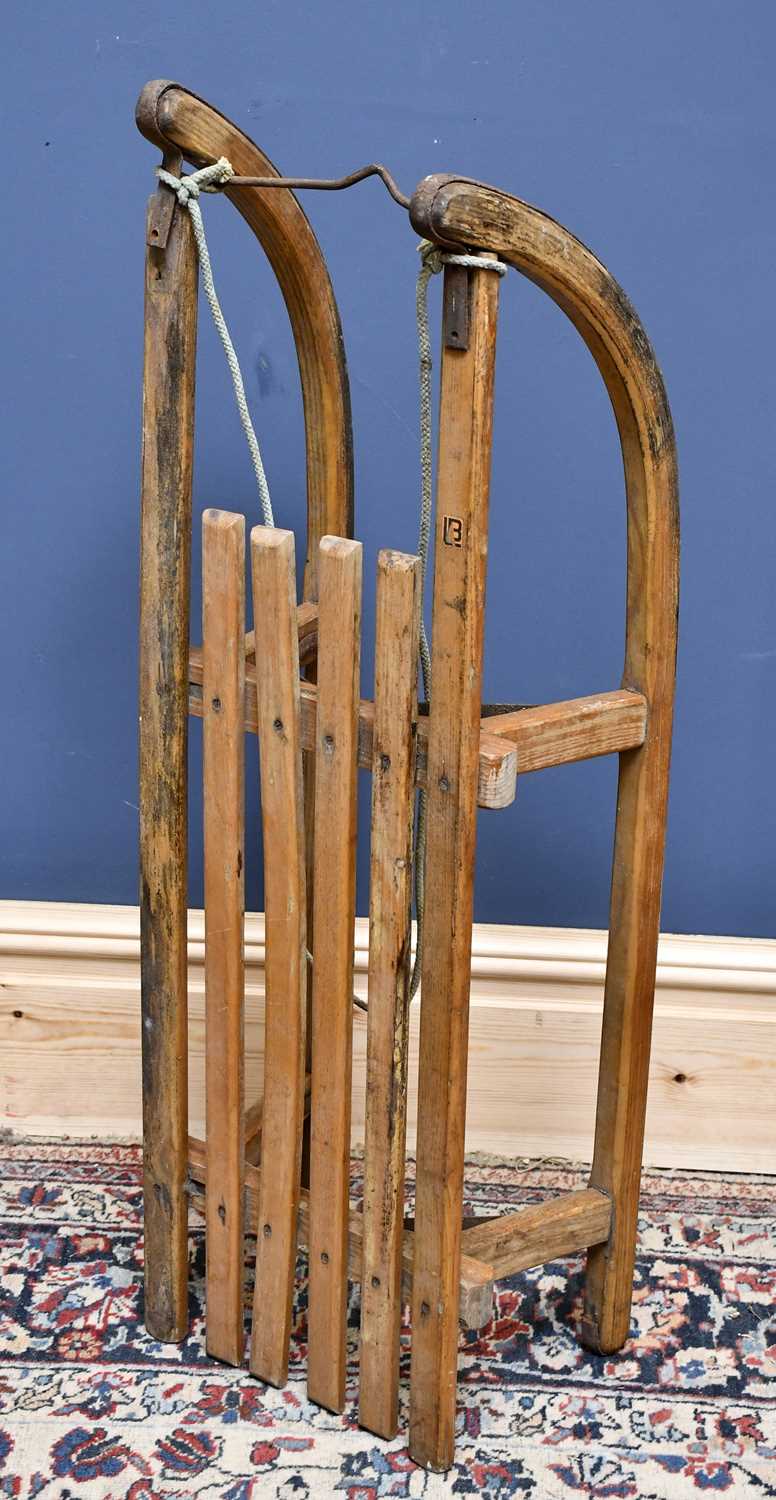 Lot 2740 - A vintage wooden Austrian sledge with