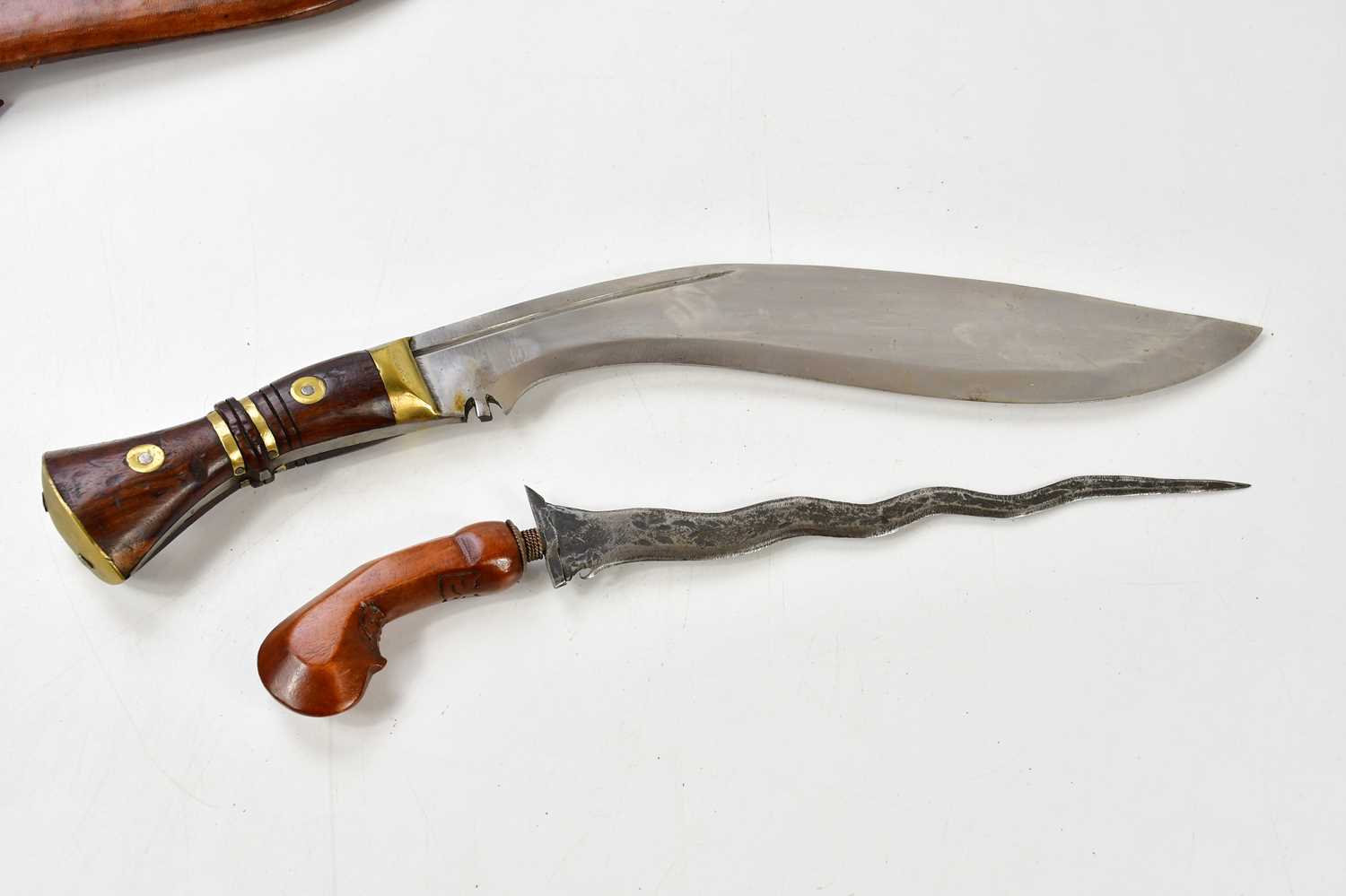 Lot 694 - An Indonesian kris dagger in brass scabbard