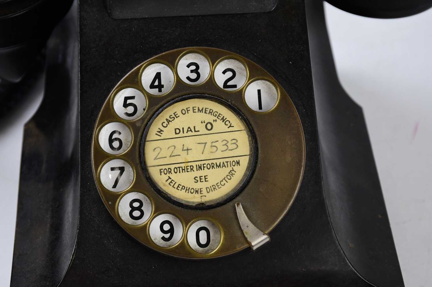 Lot 2426 - A vintage bakelite telephone, AEP, with