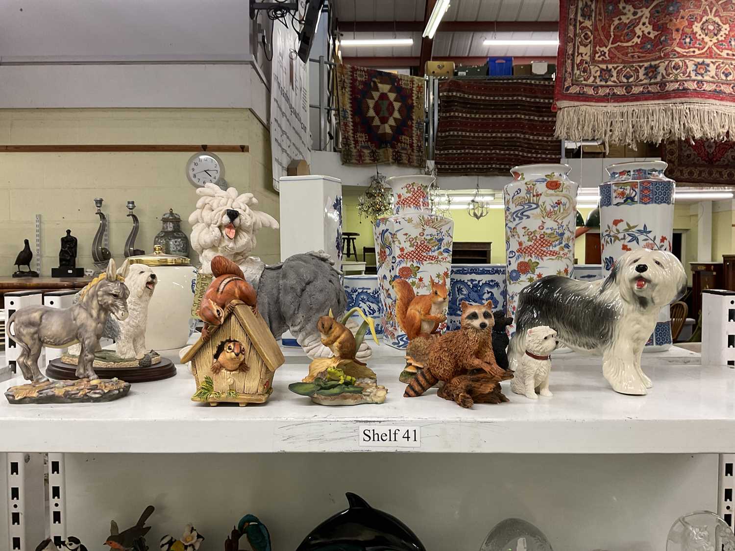 Lot 480 - A group of ten ceramic models of