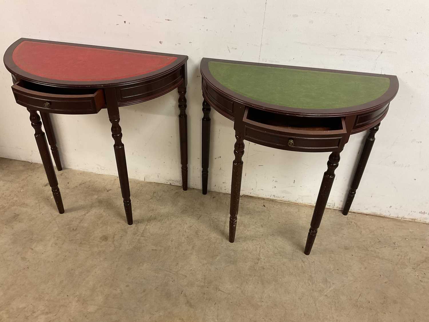 Lot 560 - A pair of reproduction demi-lune hall tables