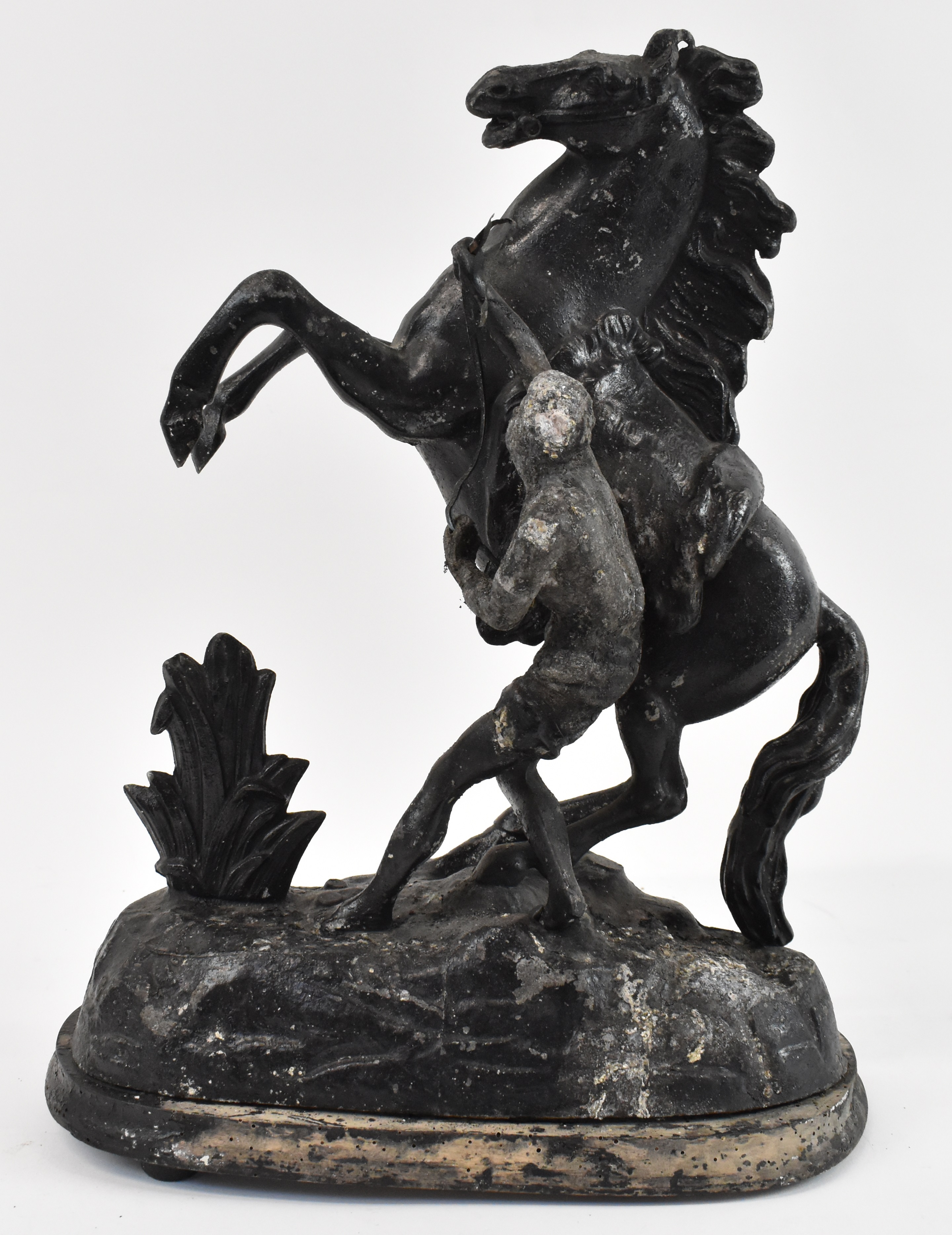 Lot 276 - An iron figure of a man on rearing horse.