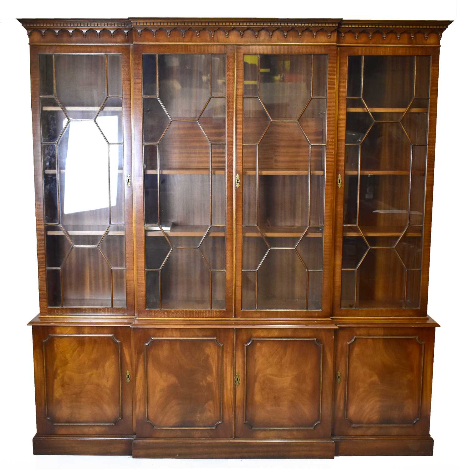 Lot 1722 - A reproduction mahogany breakfront bookcase,