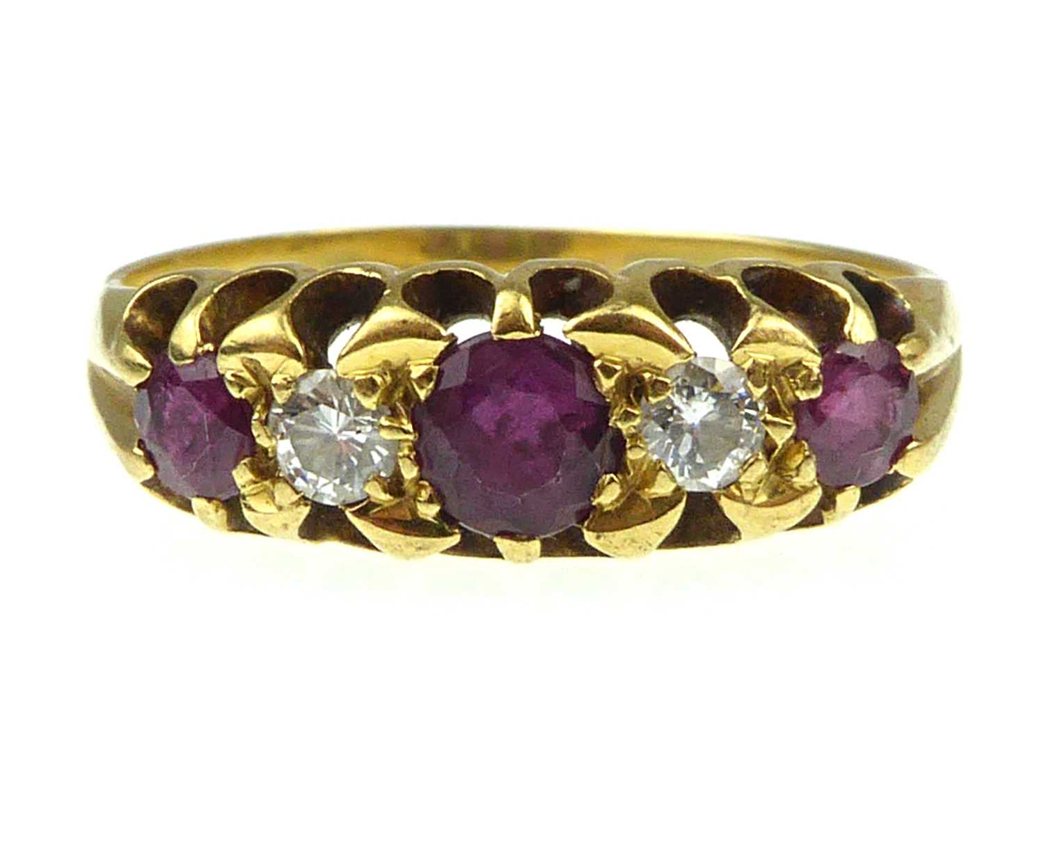 Lot 944 - An 18ct gold diamond and ruby set ring, the