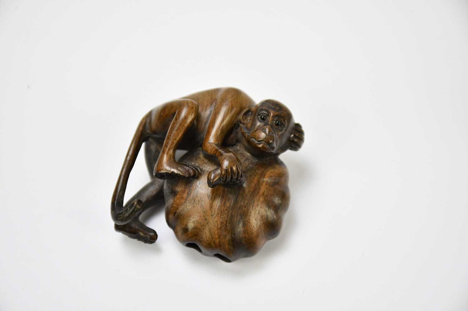Lot 2288 - Two contemporary carved wooden netsuke, one