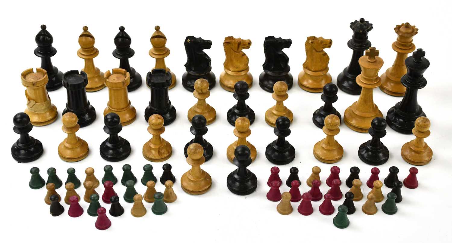 Lot 2503 - A full set of wooden chess pieces, in