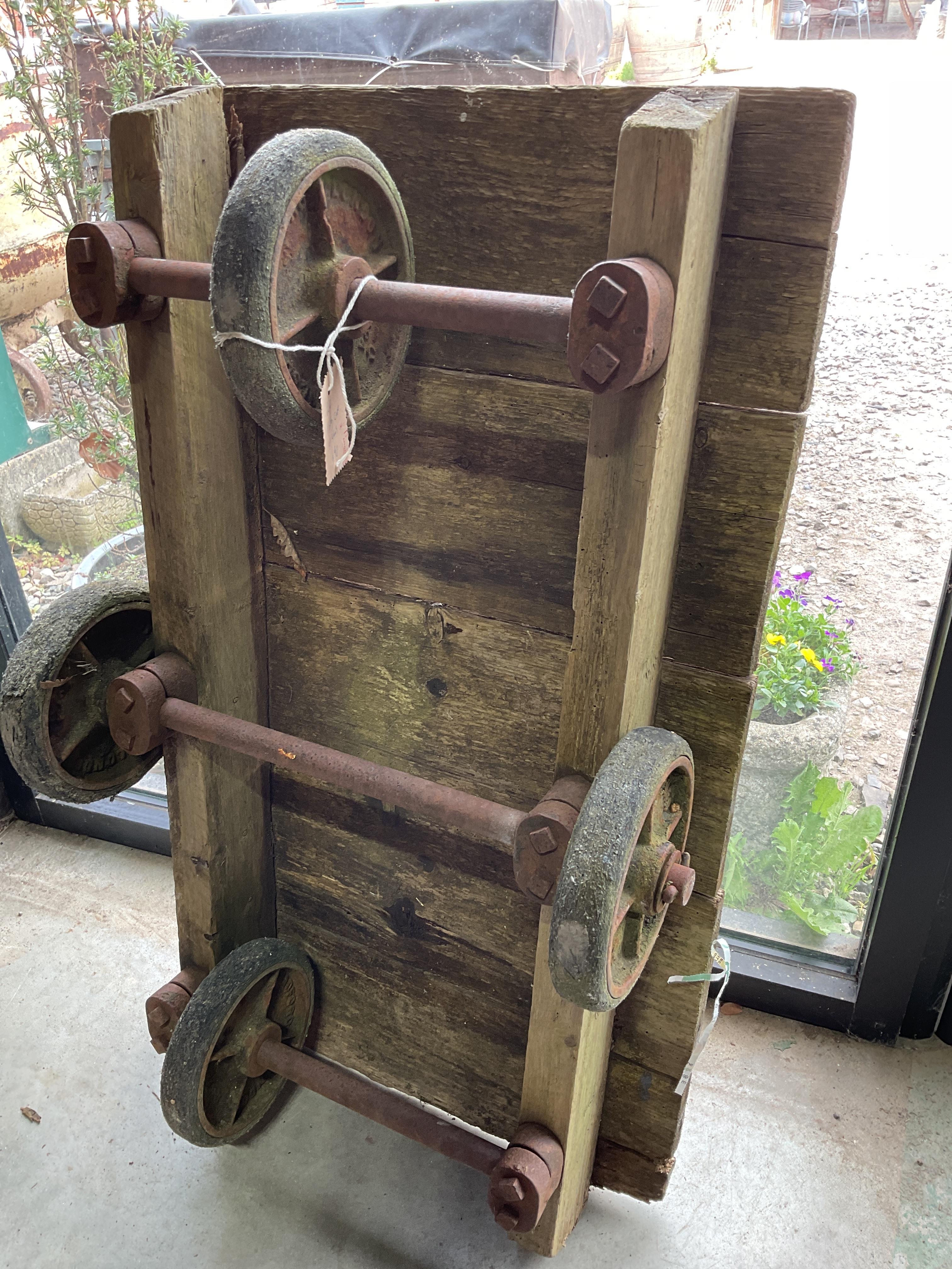 Lot 666 - An early plank trolley, with wheels marked H.
