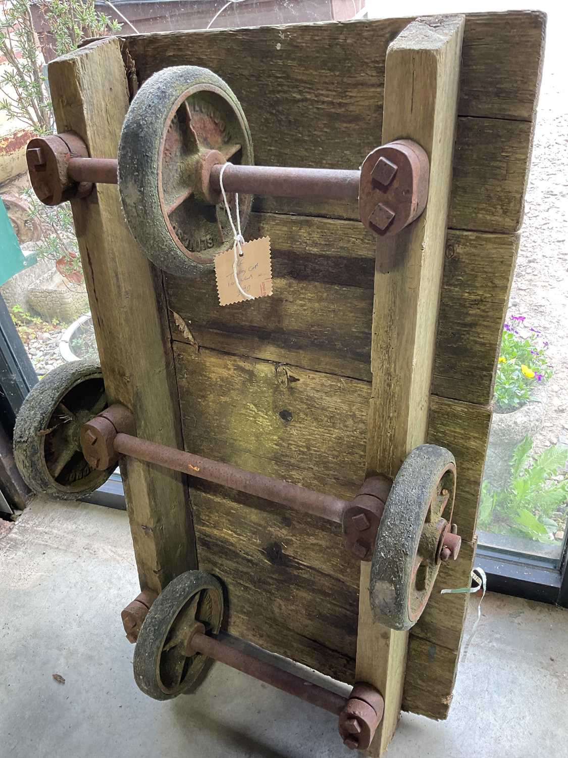 Lot 666 - An early plank trolley, with wheels marked H.