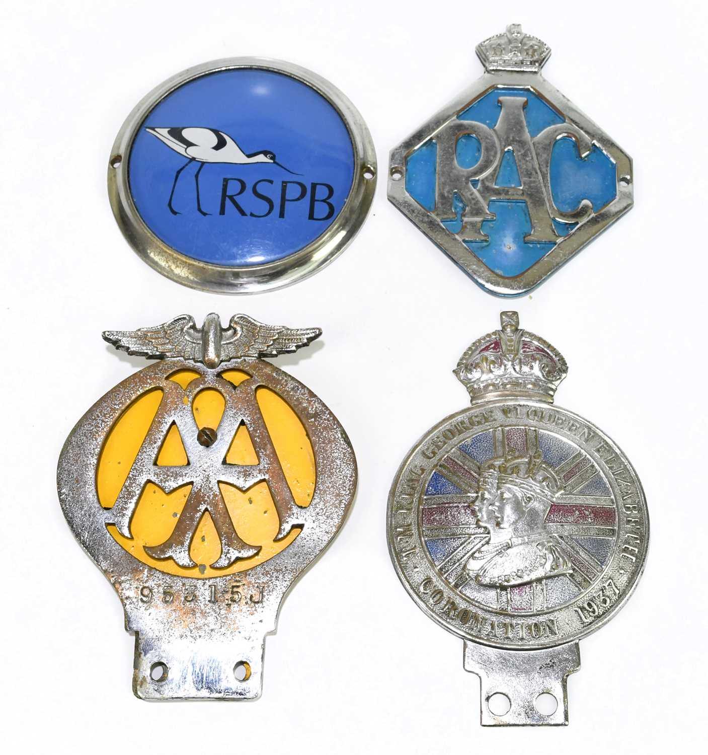 Lot 2504 - A group of four car badges to include AA,