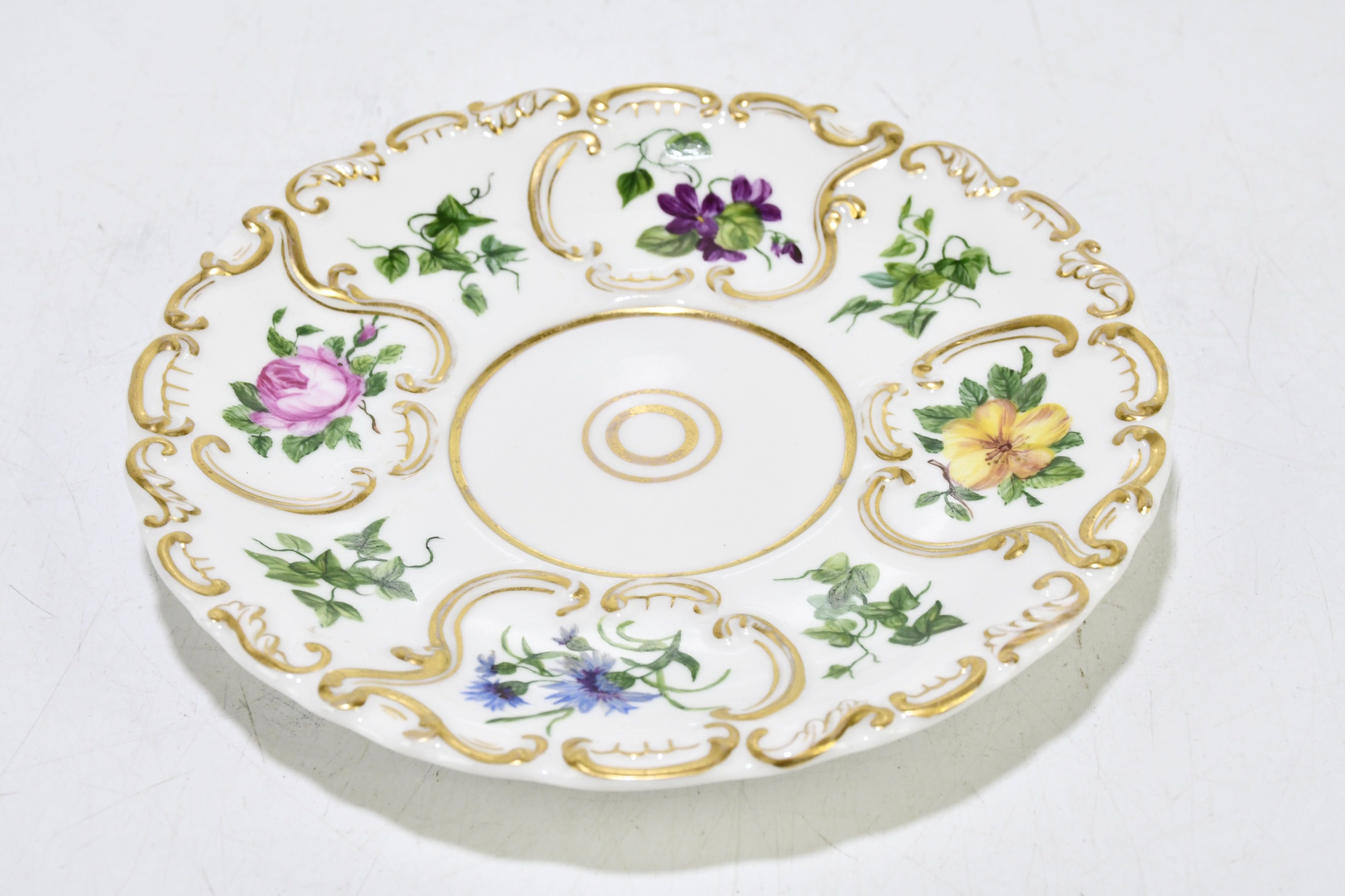 Lot 675 - KPM BERLIN; a porcelain tea cup and saucer,