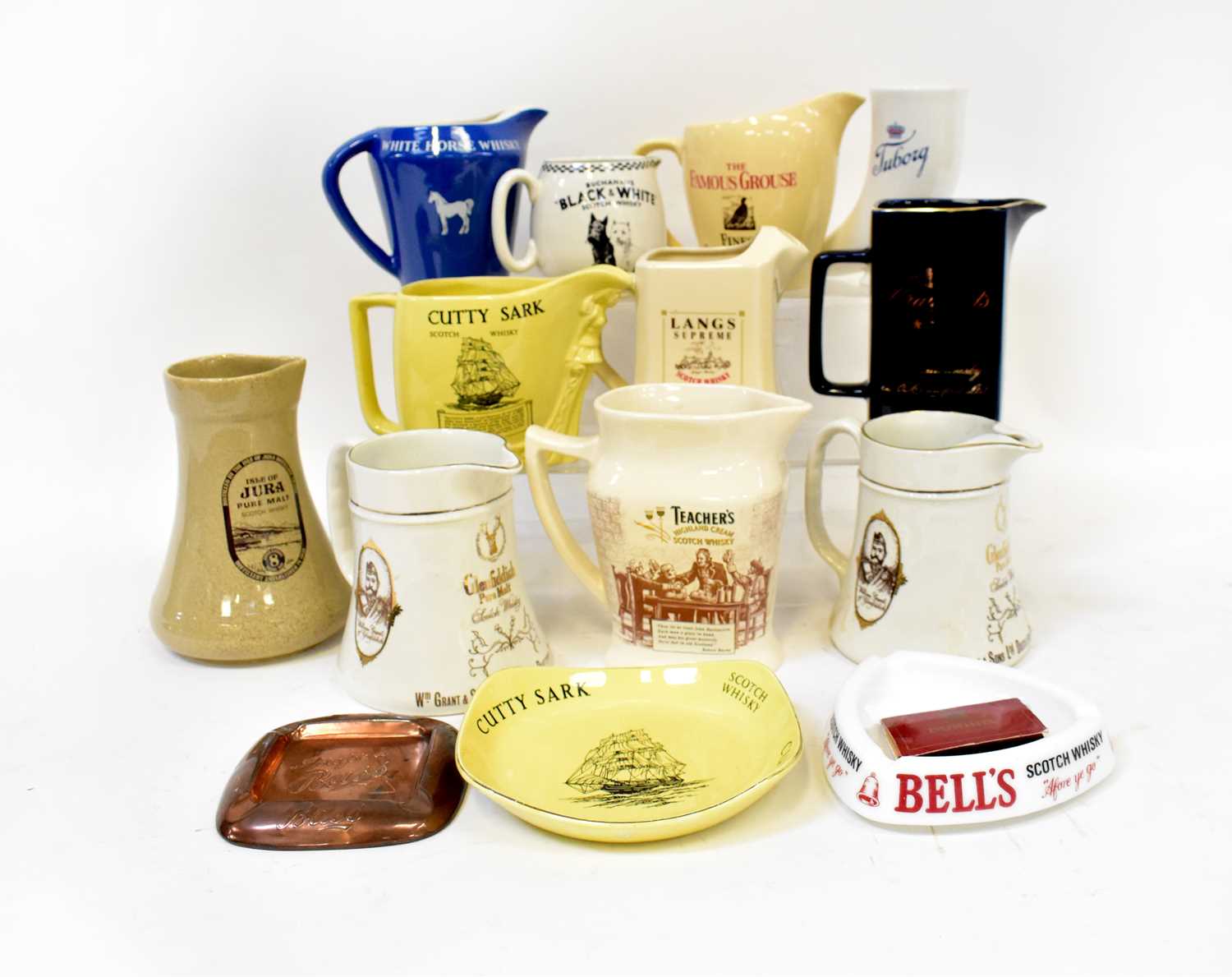 Lot 124 - A group of various whisky advertising jugs