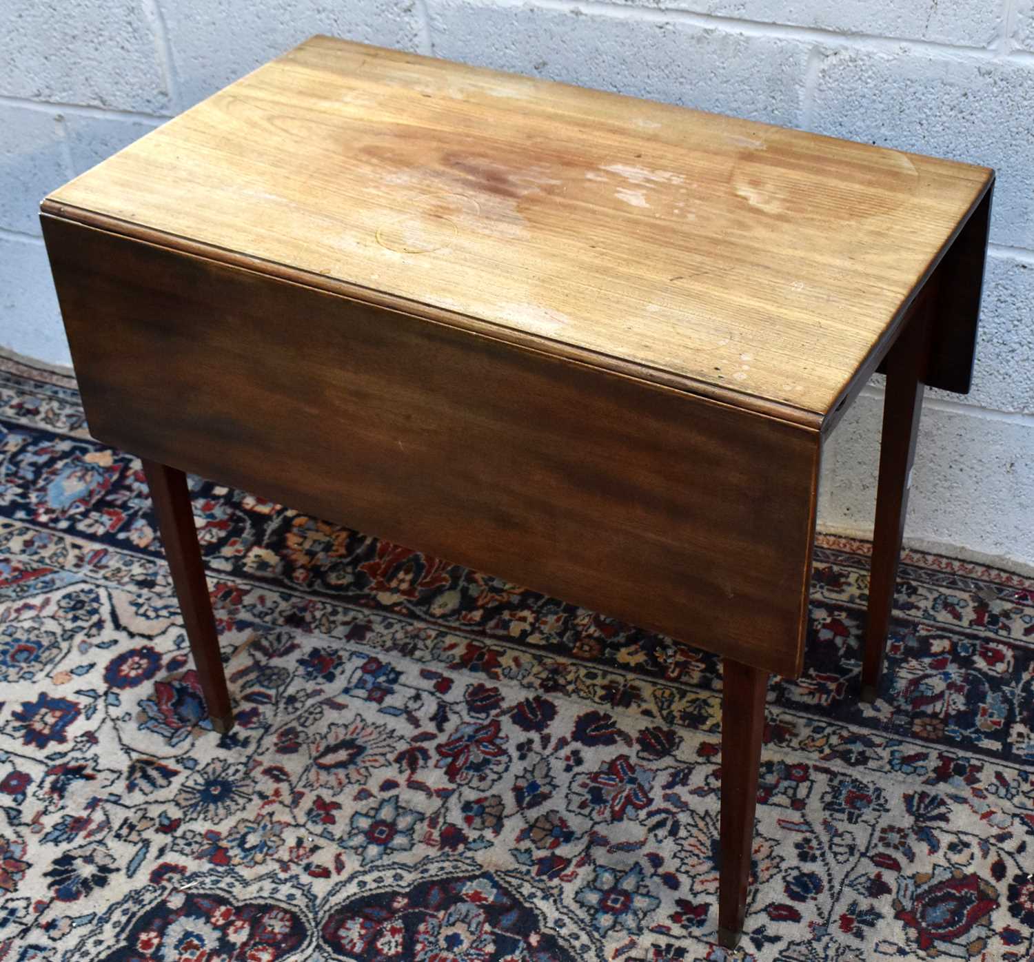 Lot 2878 - A 19th century drop leaf table, on tapered