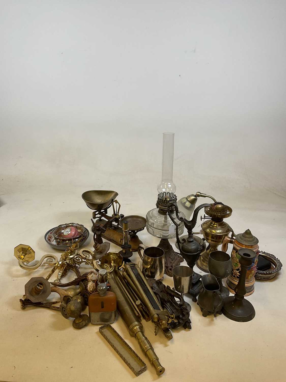 Lot 205 - A box of metal ware including oil lamps, hip