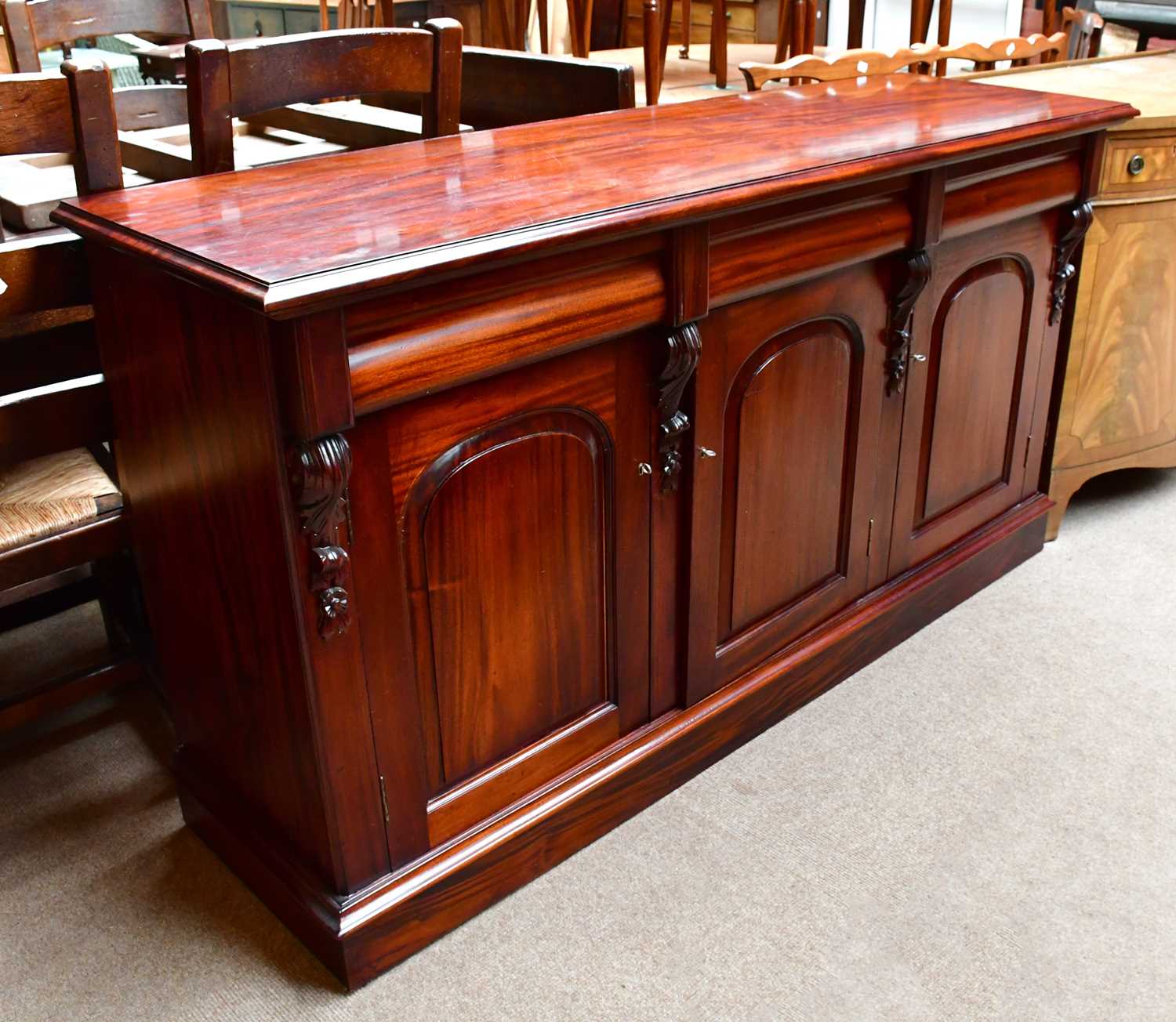 Lot 2569 - A reproduction mahogany sideboard, with